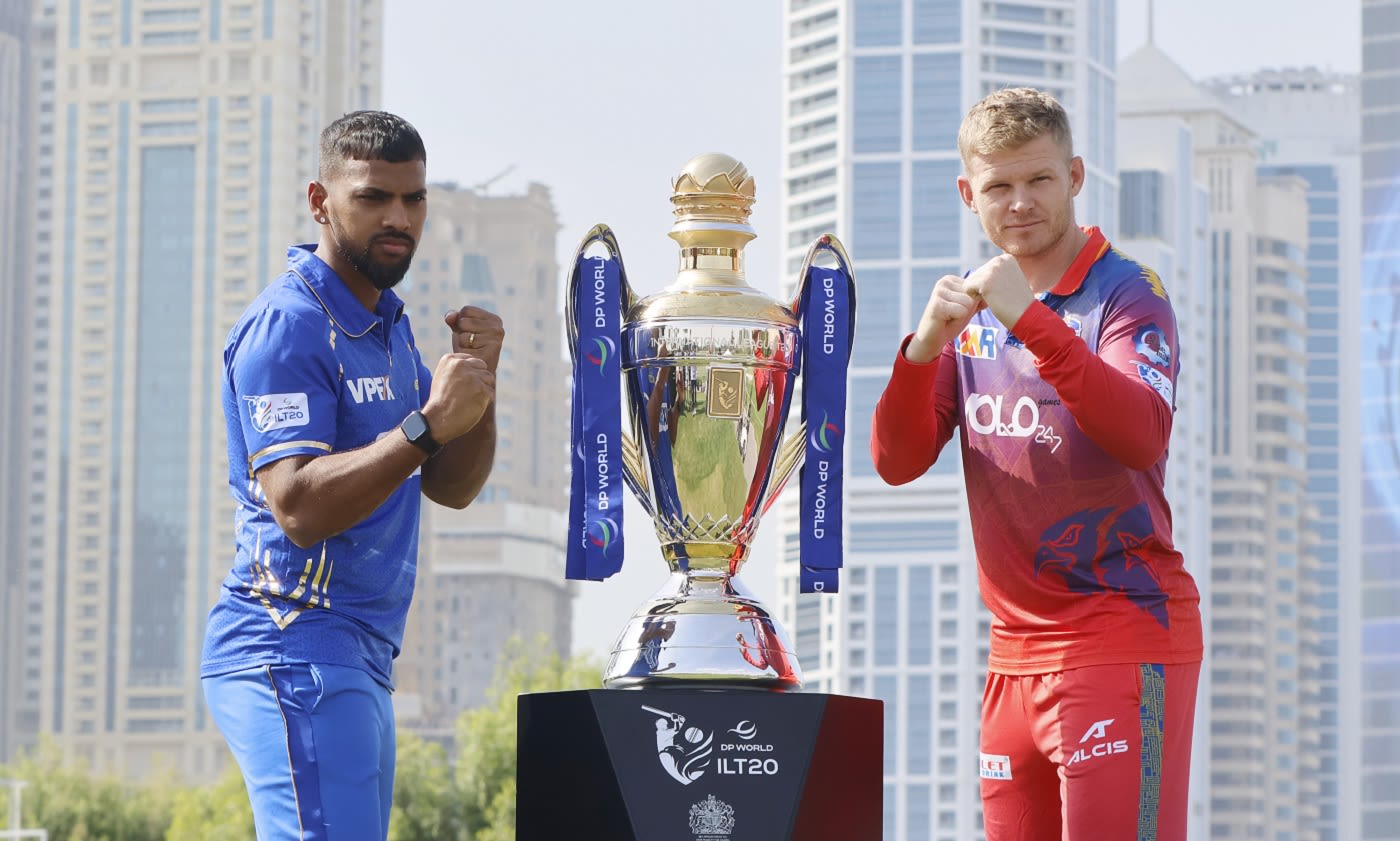 Nicholas Pooran and Sam Billings pose with the ILT20 trophy ...