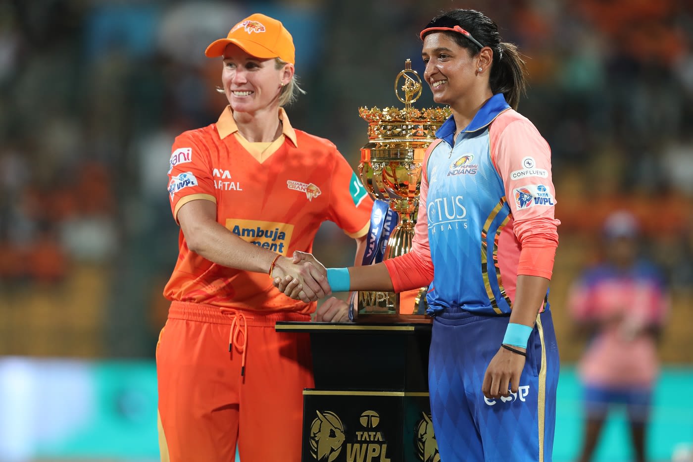 Beth Mooney and Harmanpreet Kaur pose with the WPL trophy | ESPNcricinfo.com