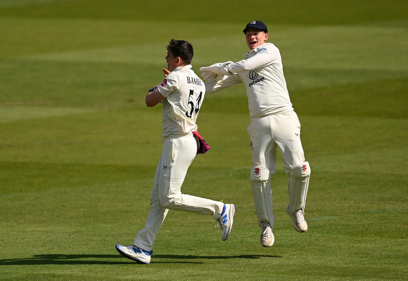 Ethan Bamber is congratulated by Jack Davies on the wicket of Harry ...