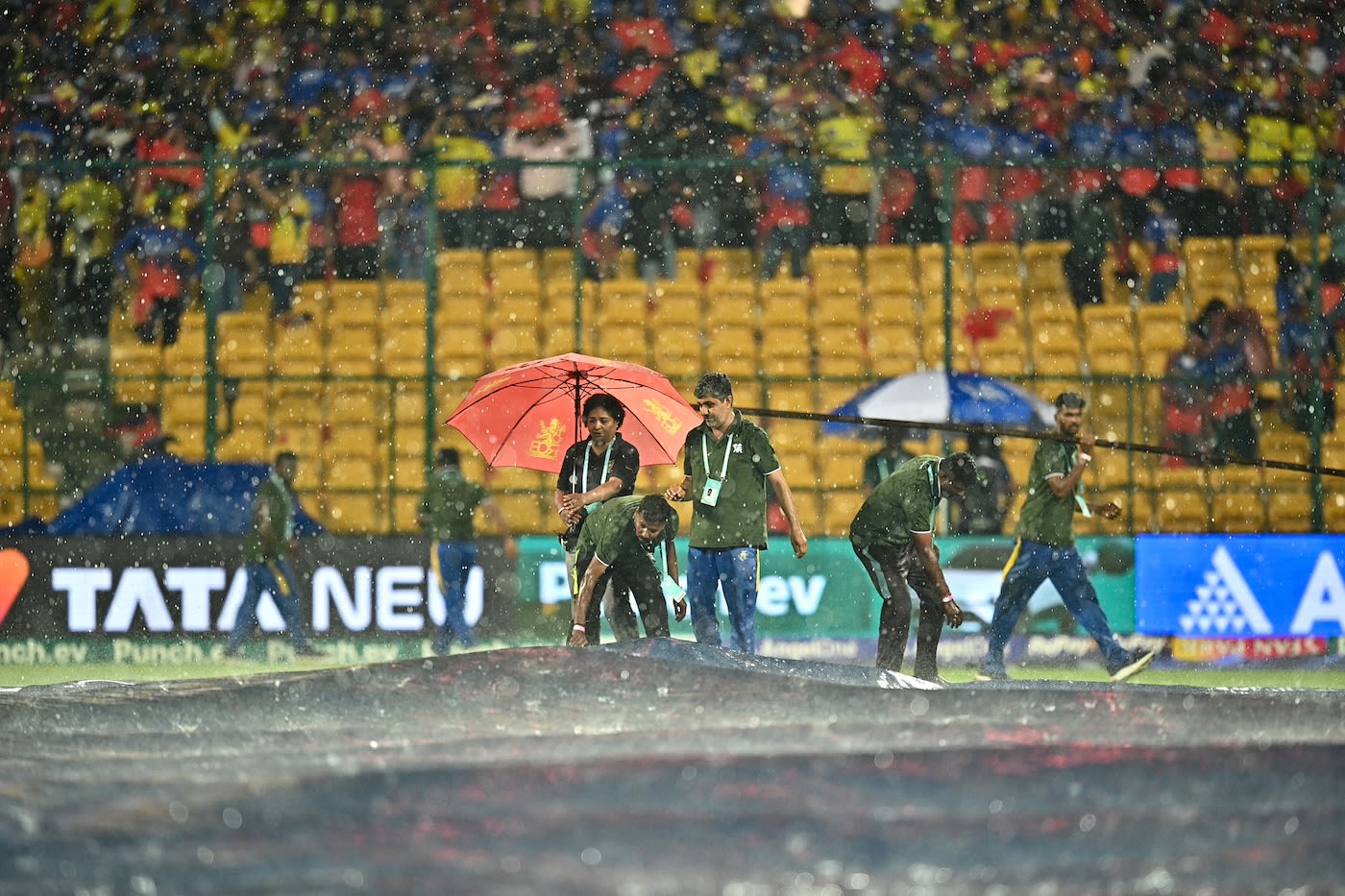 The rain, always expected, came down after three overs of play ...