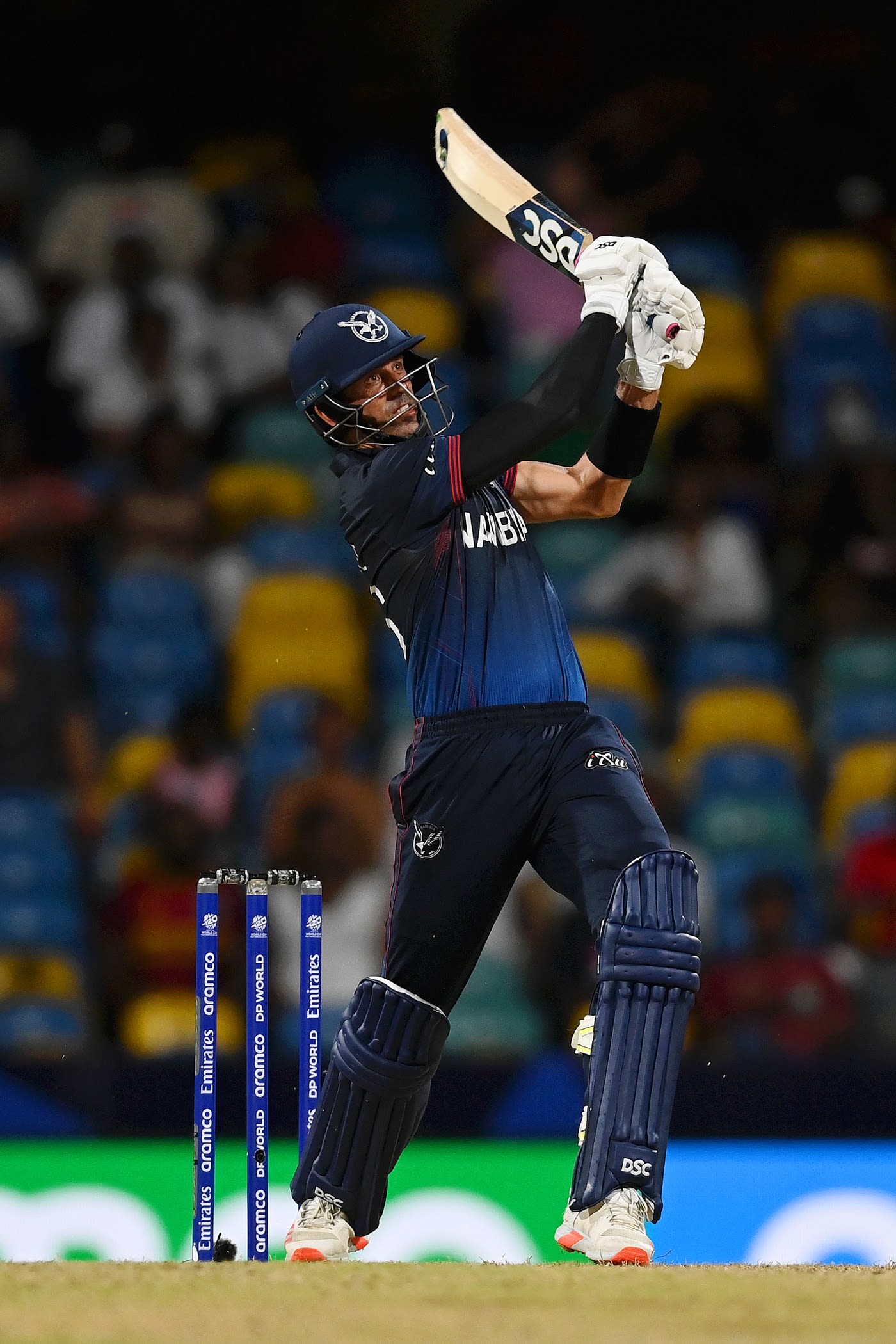 David Wiese launches the first ball of the Super Over for a six ...