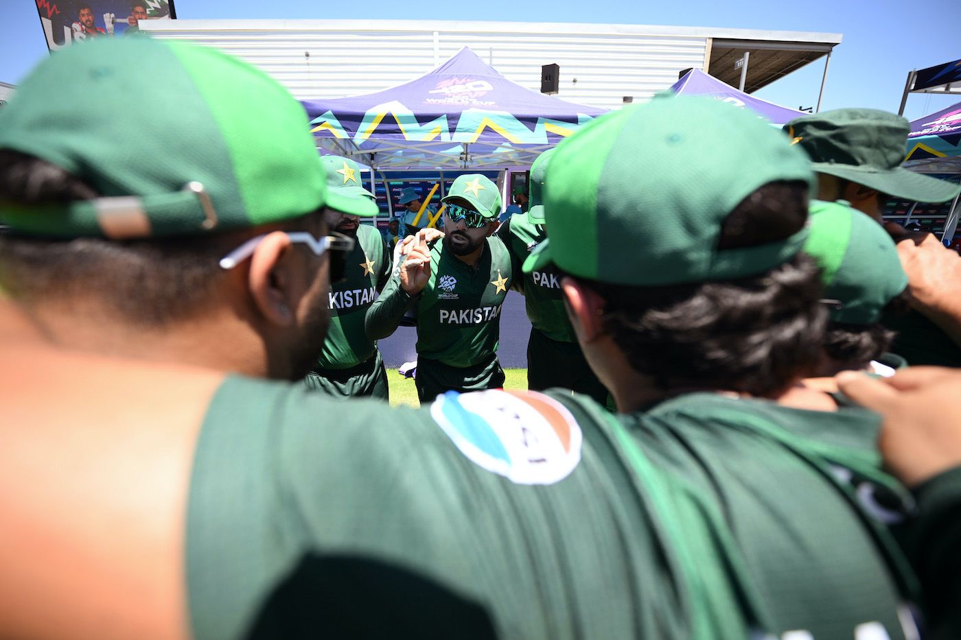 Pakistan captain Babar Azam addresses his team-mates in a huddle ...