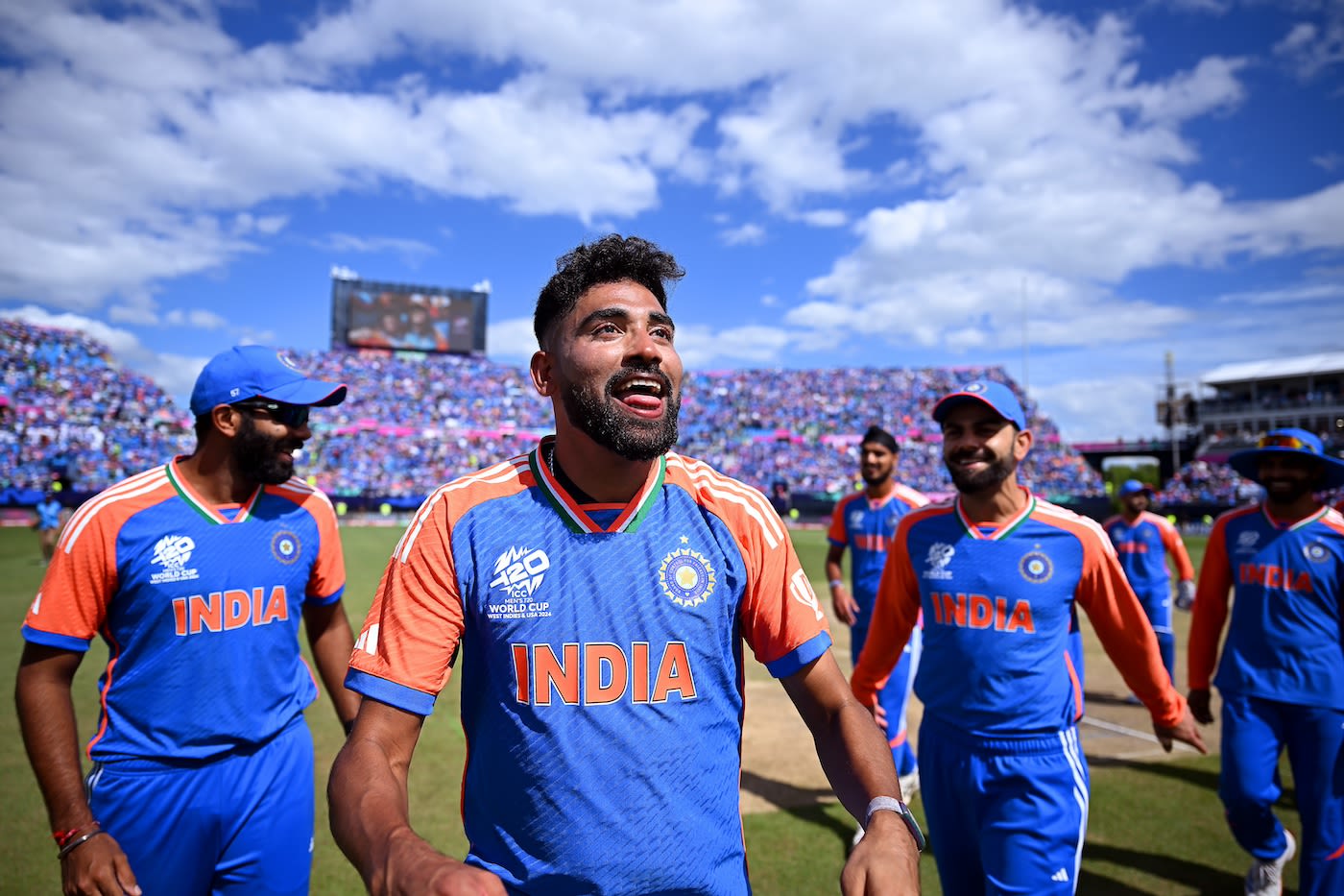 The Indian players sport happy expressions after a hard-fought win ...