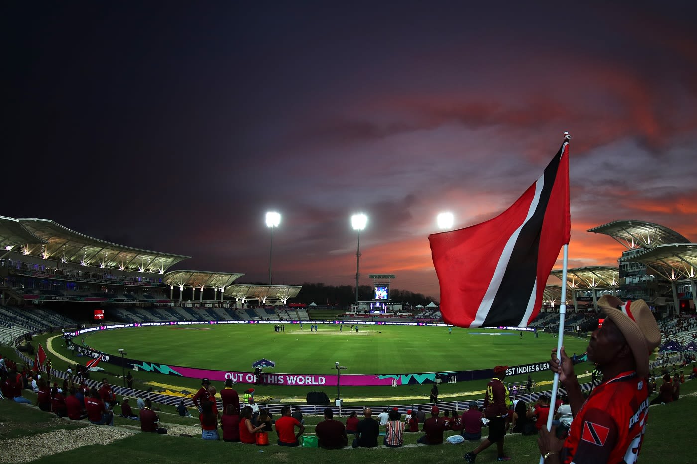 A fan with the Trinidad and Tobago flag at the Brian Lara Stadium ...