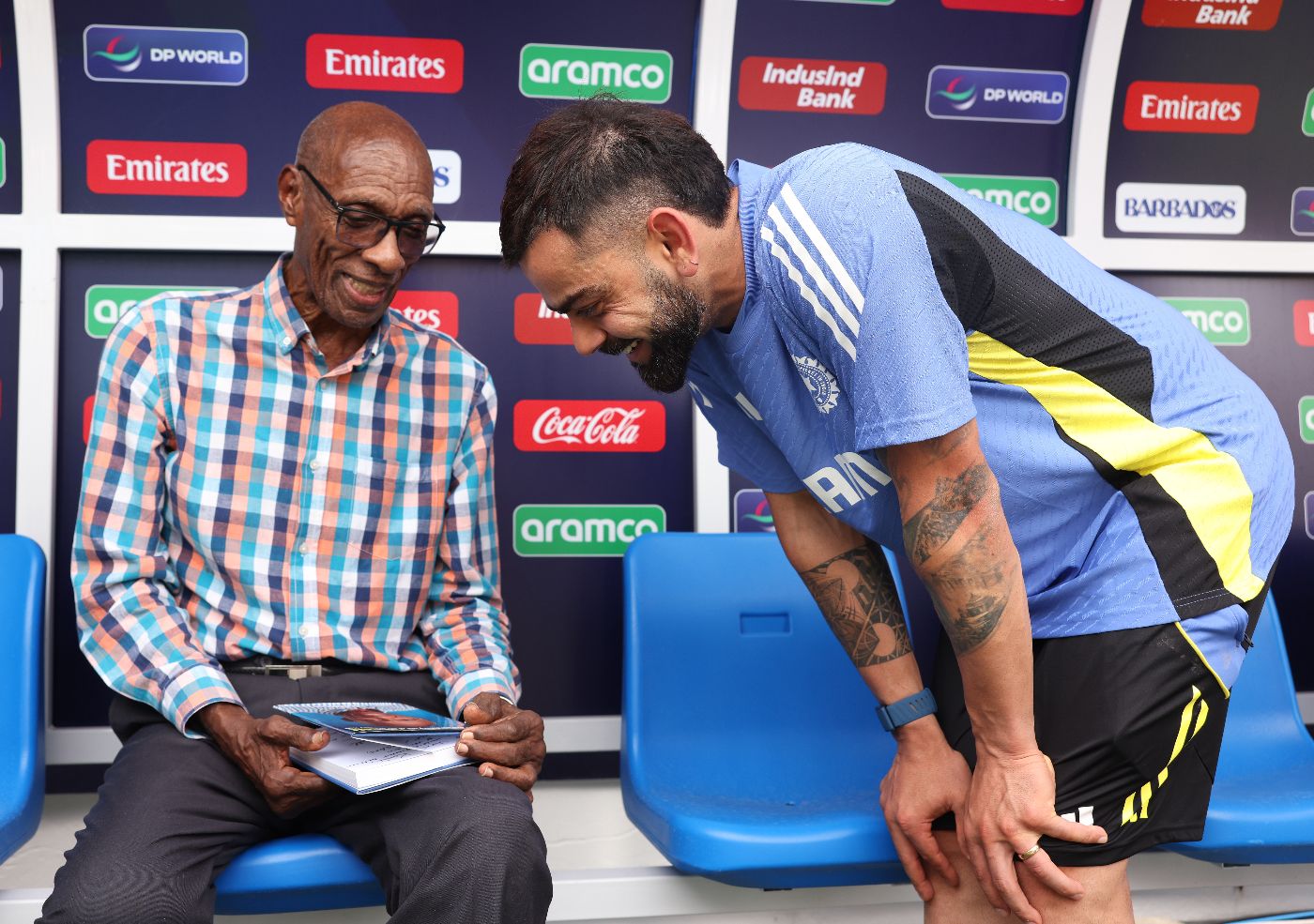 Wes Hall has a chat with Virat Kohli while presenting him with his book ...