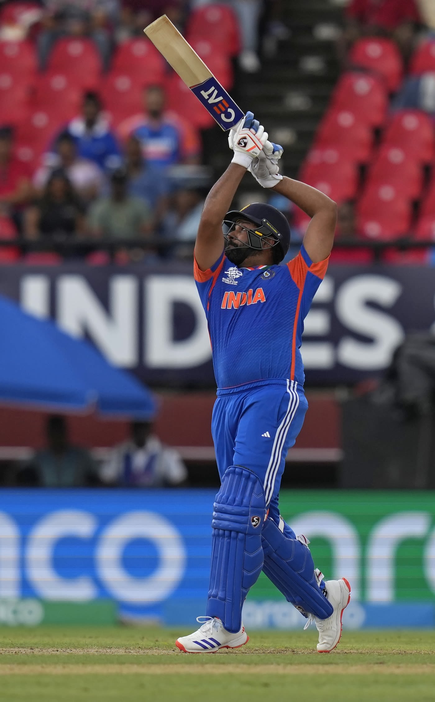 Rohit Sharma launches one over the off side by opening the face of the bat | ESPNcricinfo.com
