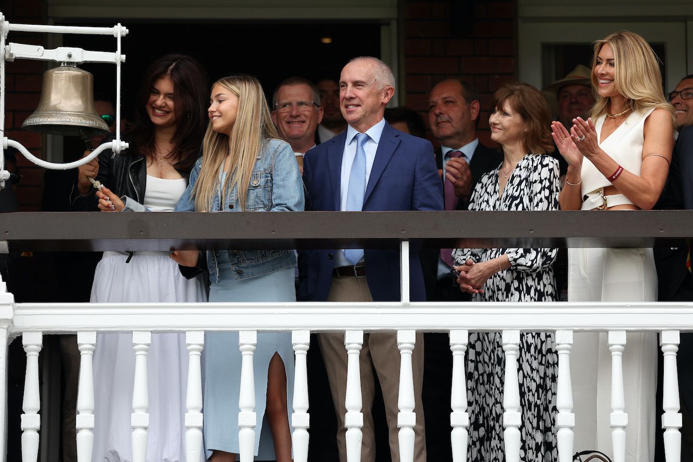 James Anderson's family including daughters Lola and Ruby ring the bell ...