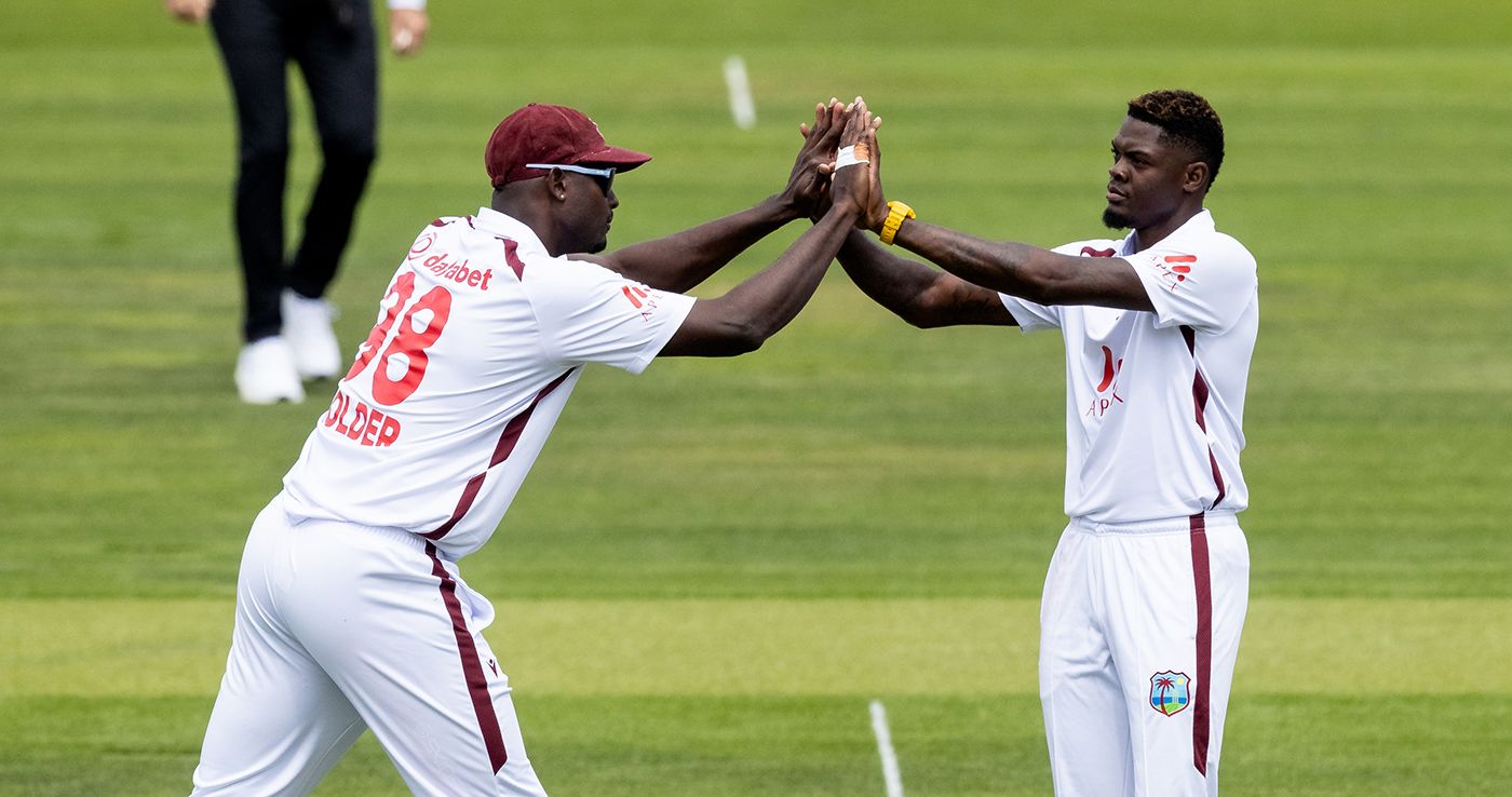 Alzarri Joseph and Jason Holder celebrate Harry Brook's dismissal ...