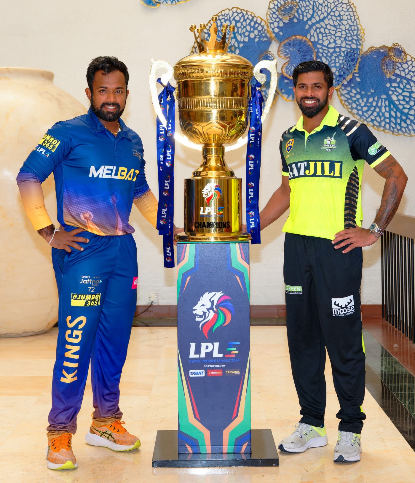Charith Asalanka and Niroshan Dickwella pose with the LPL trophy | ESPNcricinfo.com