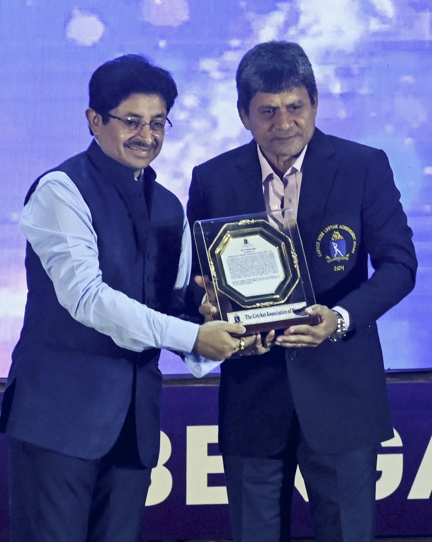 CAB president Snehasish Ganguly presents the lifetime achievement award to Pranab Roy ...