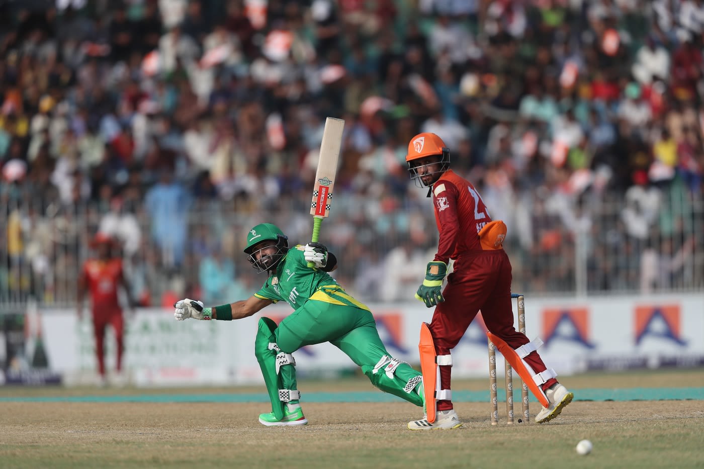 Mohammad Rizwan plays a shot towards the leg side with Mohammad Haris looking on | ESPNcricinfo.com