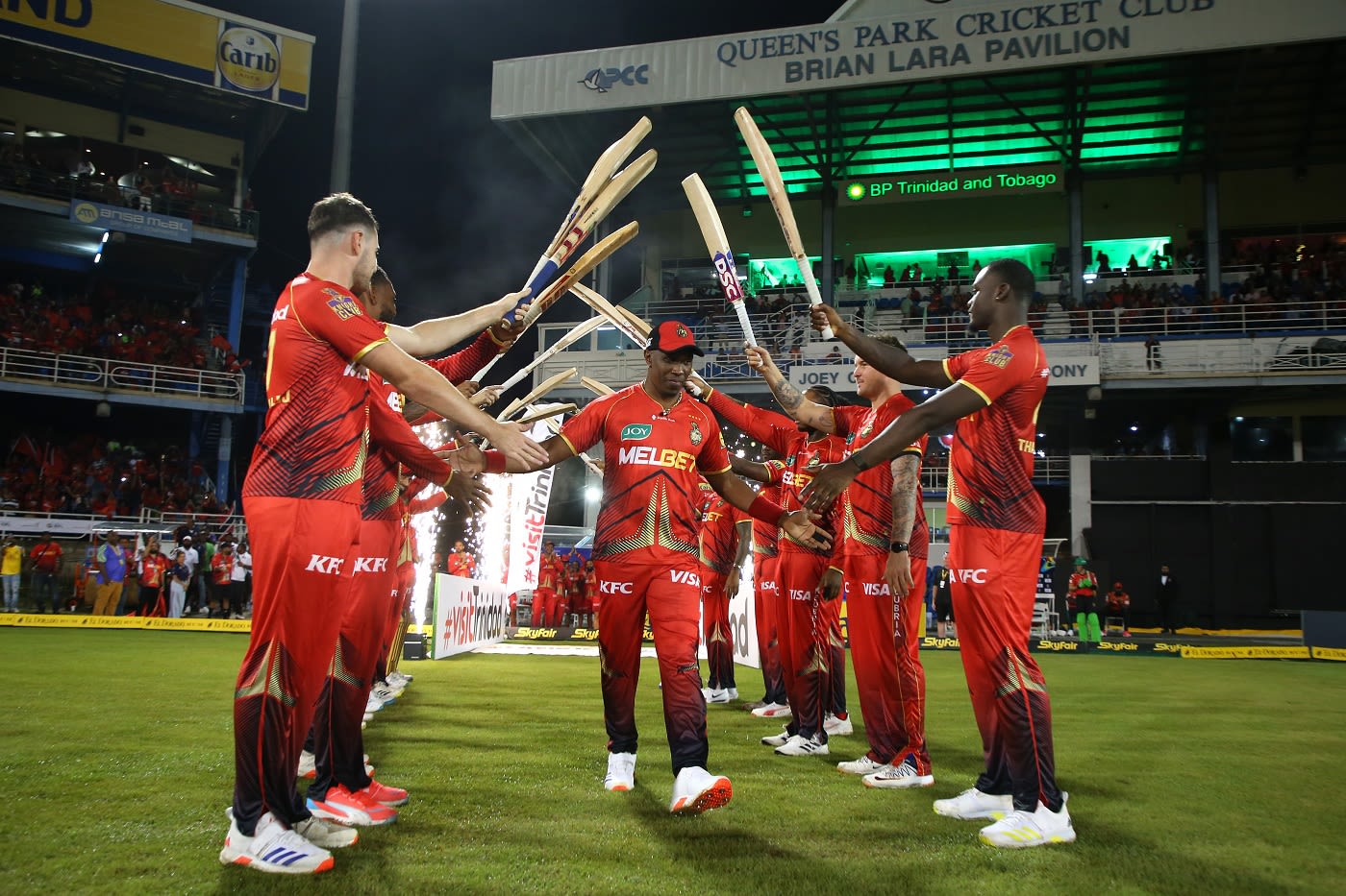 Dwayne Bravo is given a guard of honour by his team-mates ...