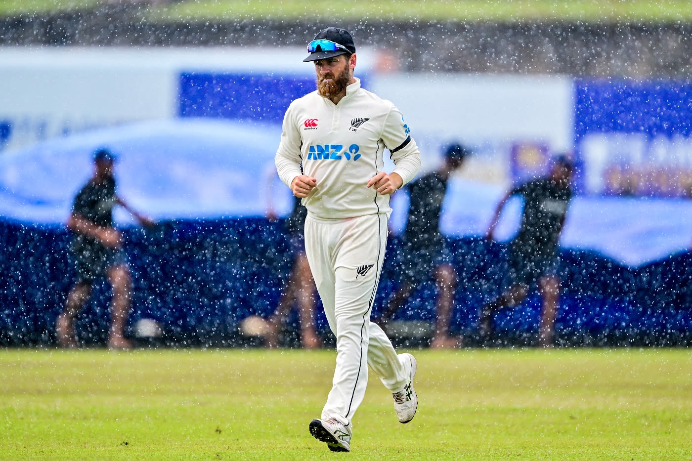 Kane Williamson walks back to the pavilion as rain stops play ...