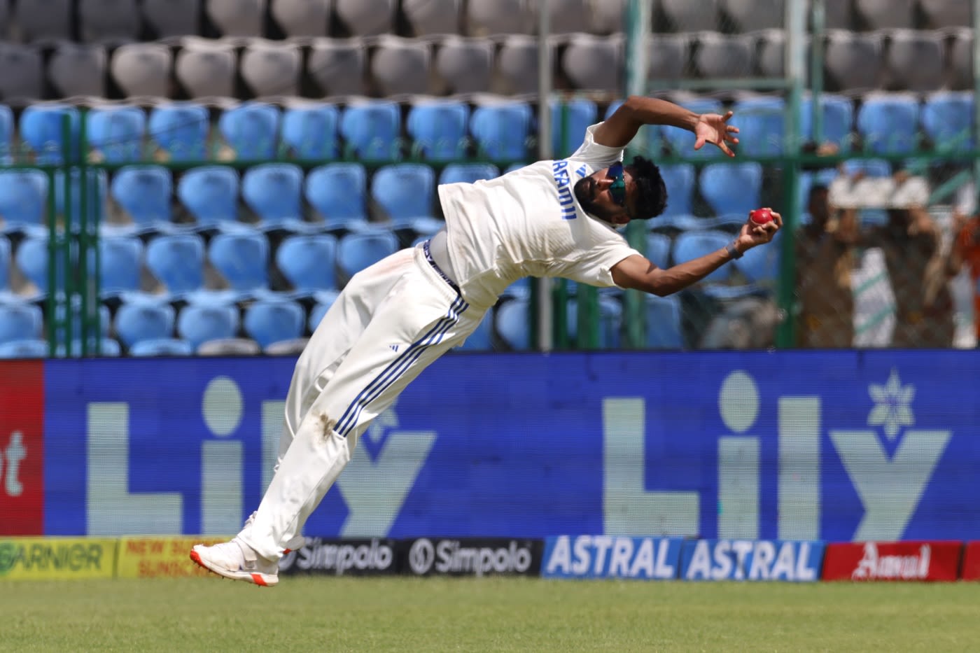 Mohammed Siraj took a one-handed catch while falling over backwards to ...