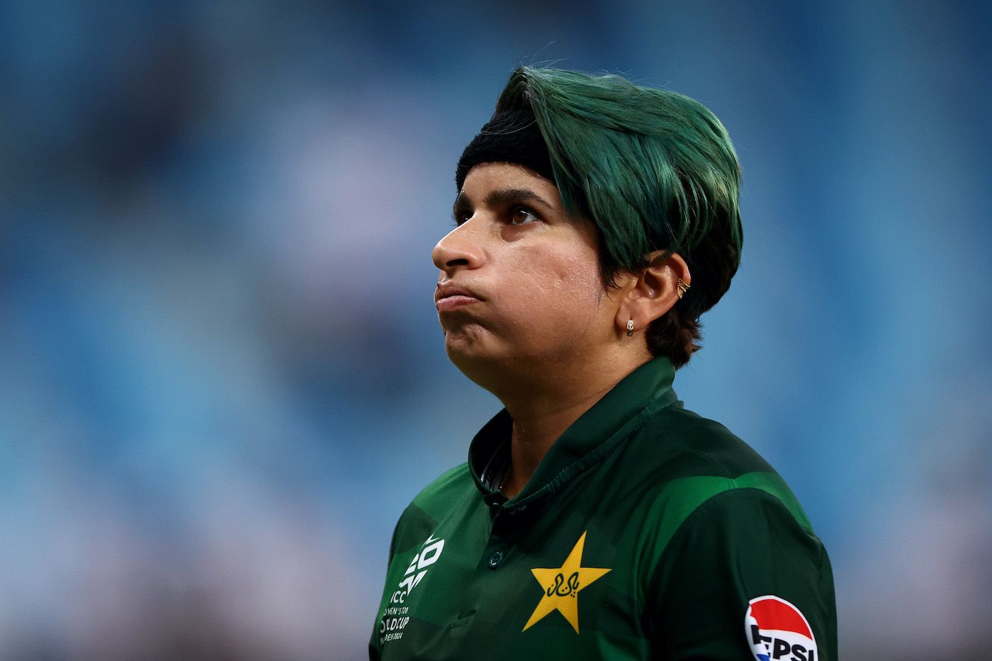 A green-haired Nida Dar looks on | ESPNcricinfo.com