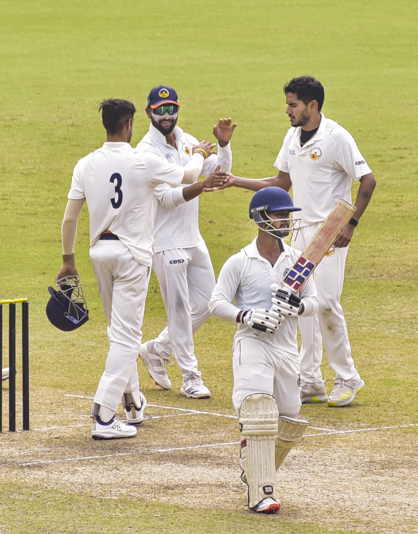 Chandigarh's players celebrate the wicket of Abhishek Thakuri ...