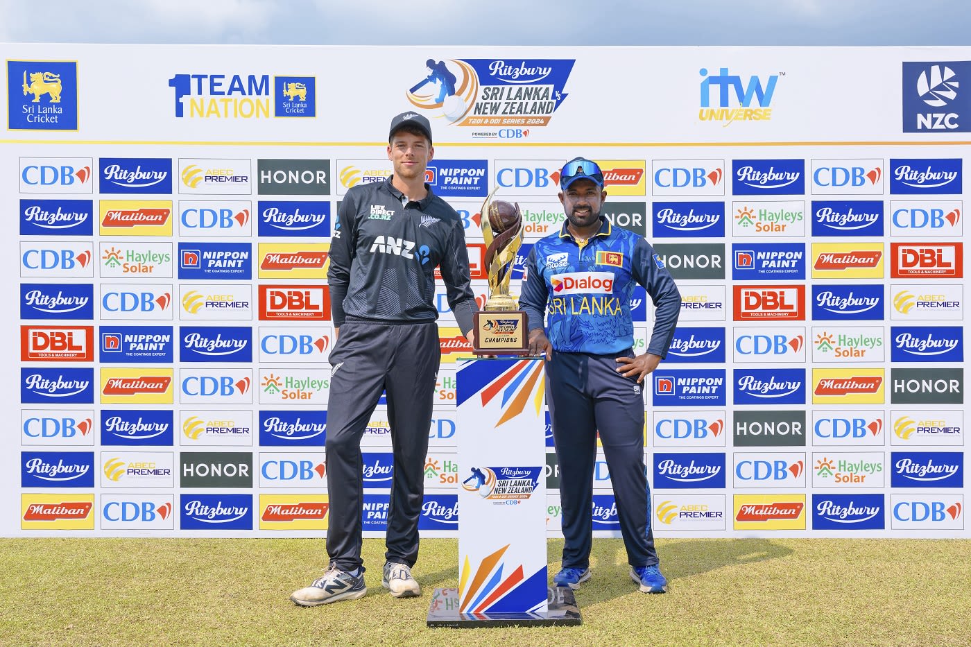 Mitchell Santner and Charith Asalanka pose with the ODI series trophy | ESPNcricinfo.com