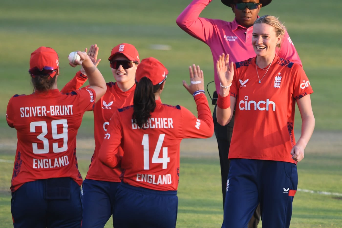 Lauren Bell is all smiles after picking up an early wicket ...