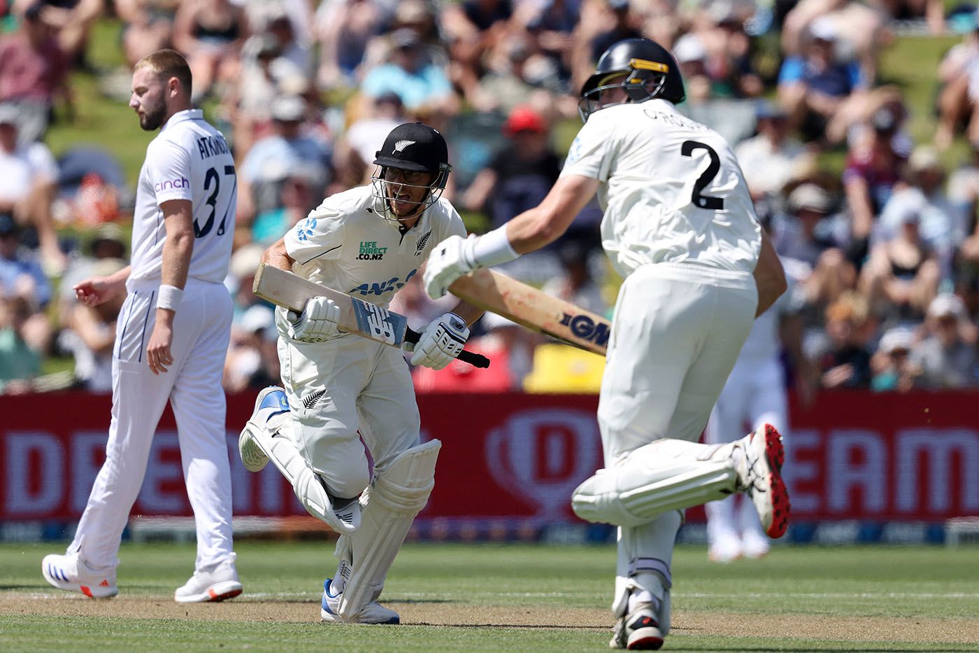 Mitchell Santner and Will O'Rourke run between the wickets ...
