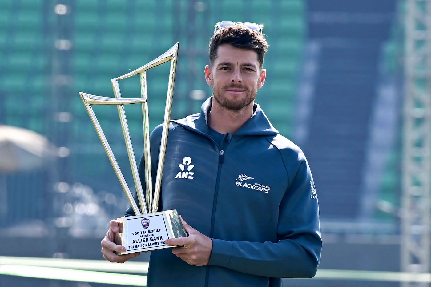 Mitchell Santner poses with the tri-series trophy | ESPNcricinfo.com