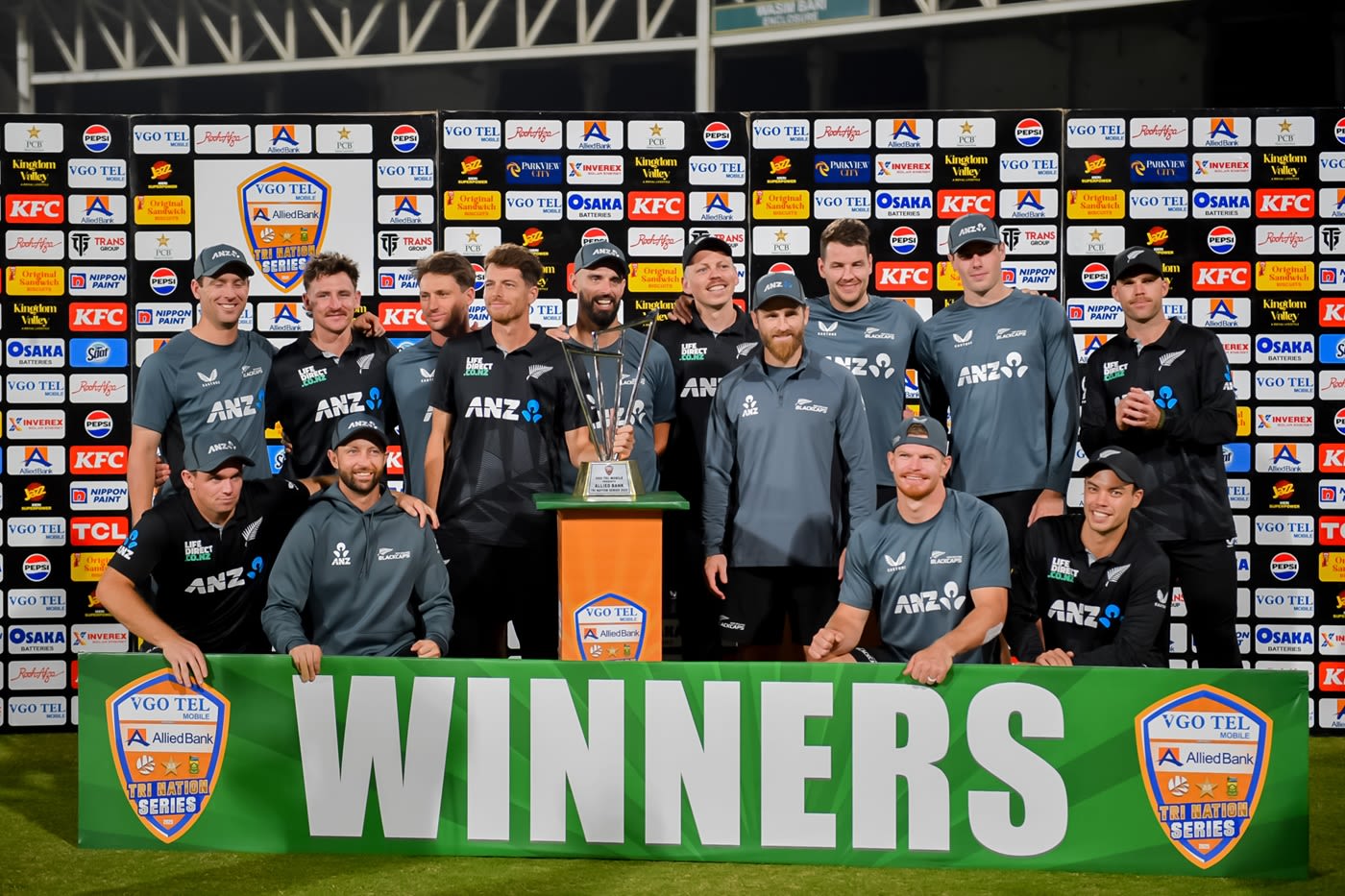 New Zealand players pose with the tri-series trophy | ESPNcricinfo.com