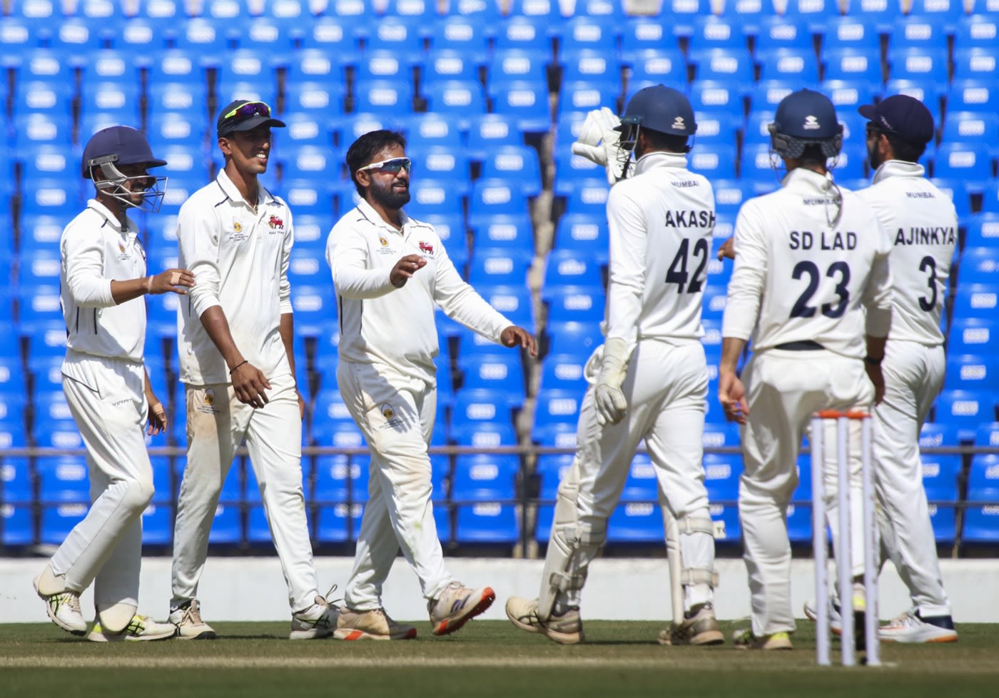 Shams Mulani celebrates a wicket with his team-mates | ESPNcricinfo.com