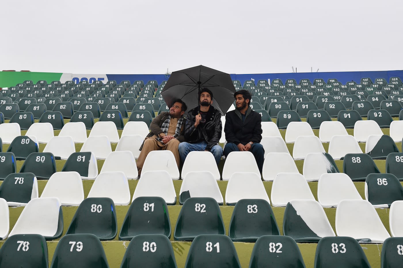 Fans wait in the rain for the action to begin | ESPNcricinfo.com