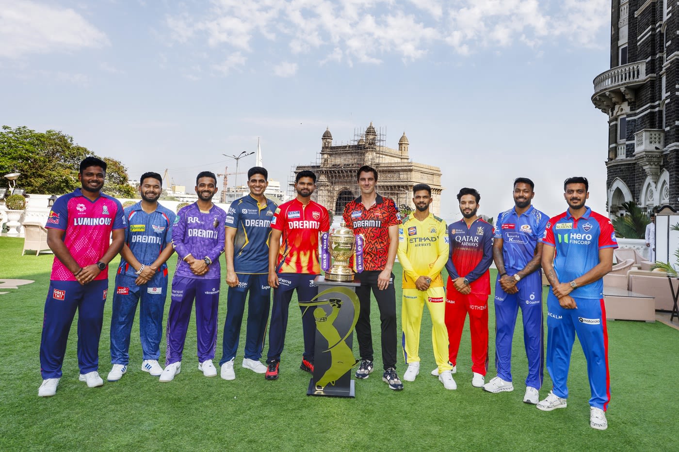 The captains of IPL 2025 pose with the trophy | ESPNcricinfo.com