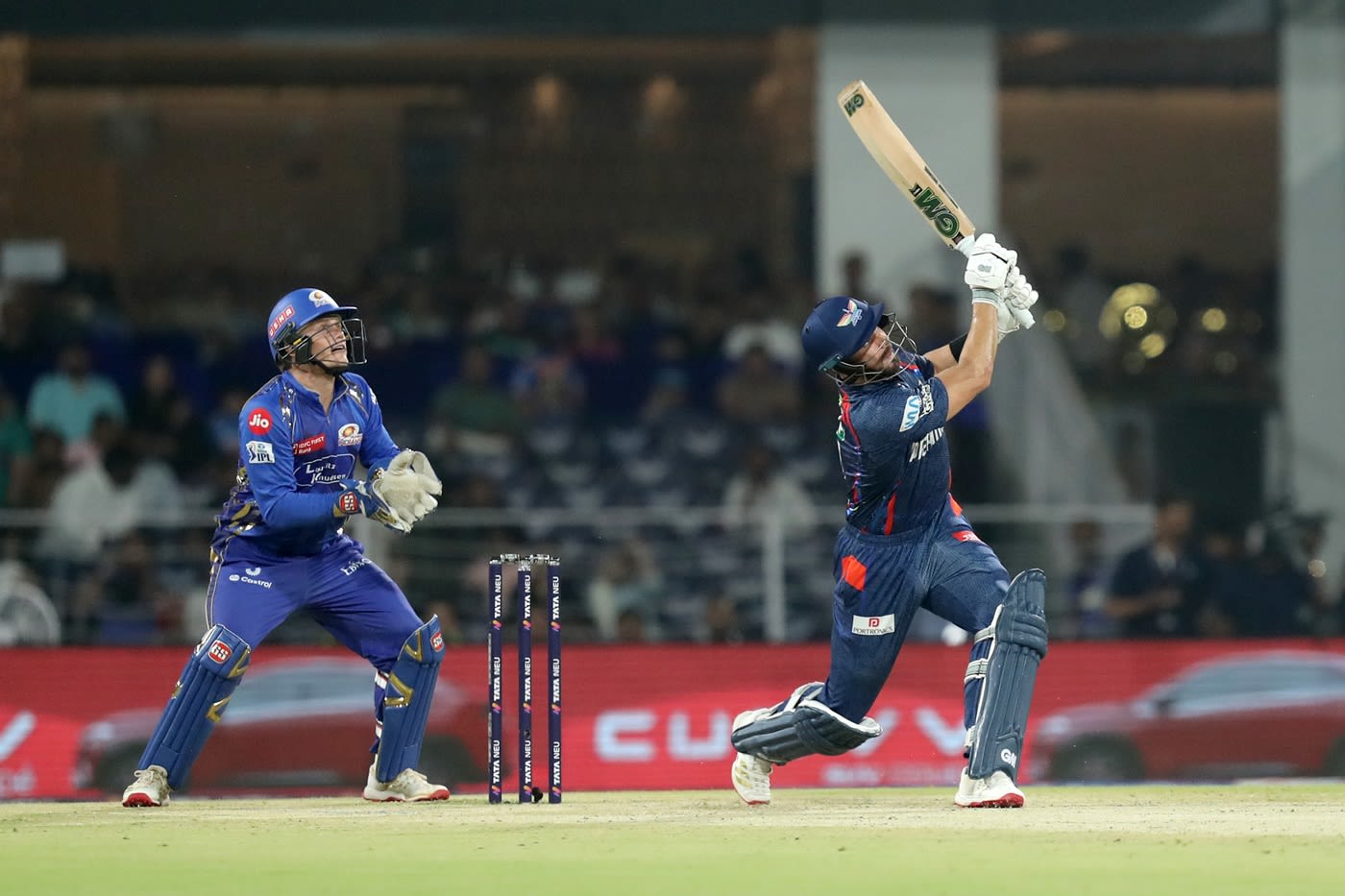 Ryan Rickelton watches the ball fly off Aiden Markram's bat ...
