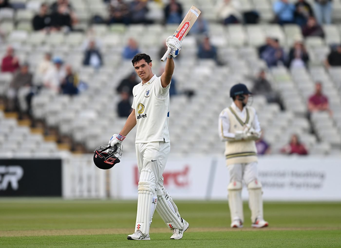 Tom Clark raises his bat on reaching a century | ESPNcricinfo.com