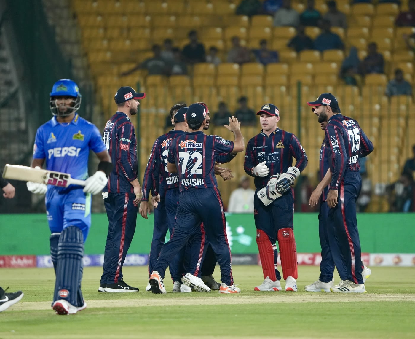 The Karachi Kings players celebrate the wicket of Shai Hope ...