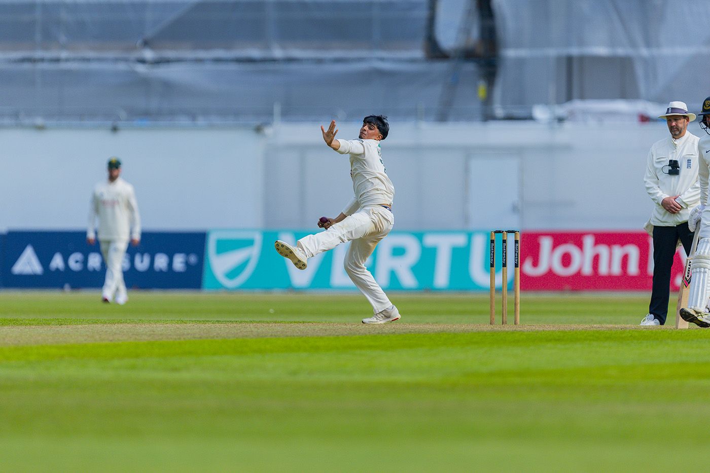 Farhan Ahmed in his delivery stride | ESPNcricinfo.com