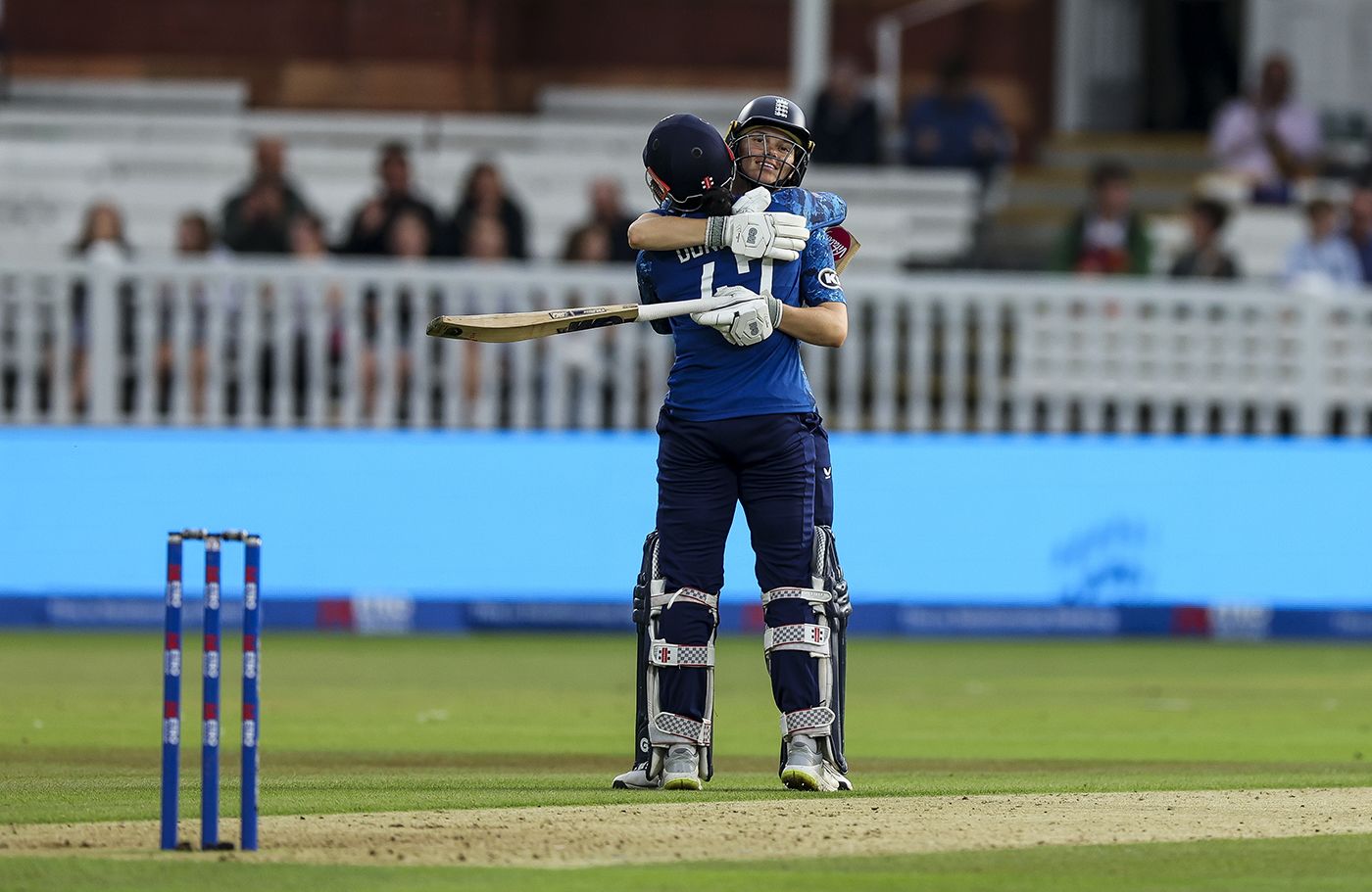 Amy Jones gets a hug from Sophia Dunkley | ESPNcricinfo.com