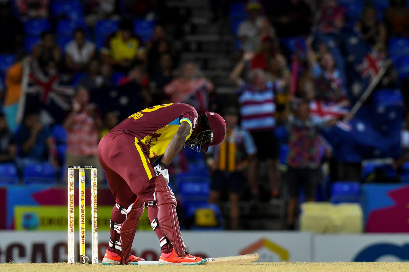 Sherfane Rutherford drops his bat in frustration after being dismissed ...