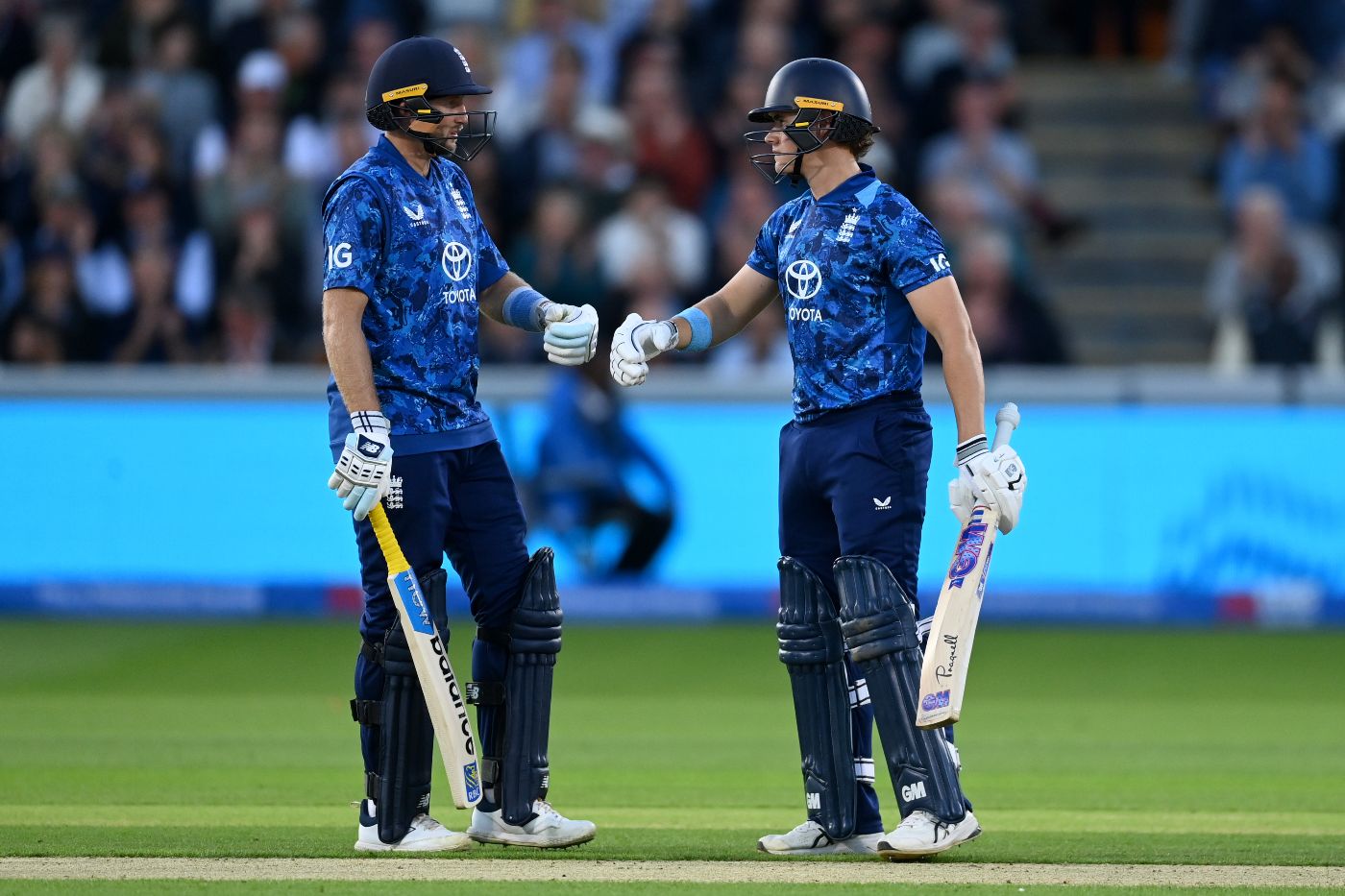 Jacob Bethell gets congratulated by Joe Root after reaching fifty ...