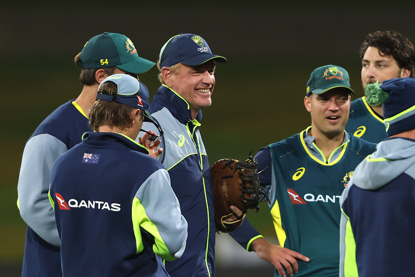 Australia head coach Andrew McDonald chats with his players ...