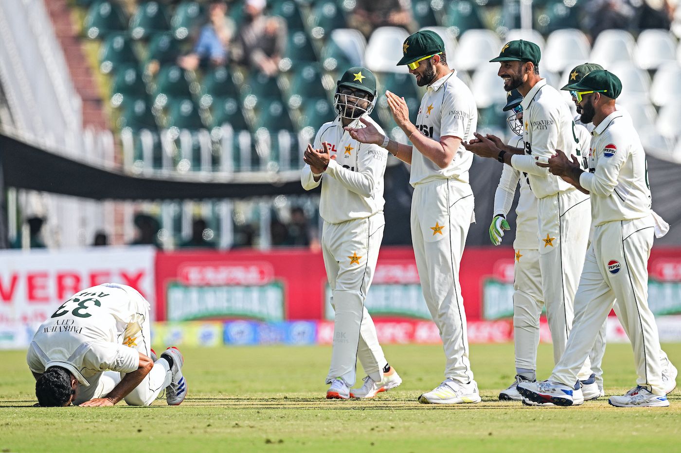 Team-mates watch Asif Afridi as he celebrates his five-for ...