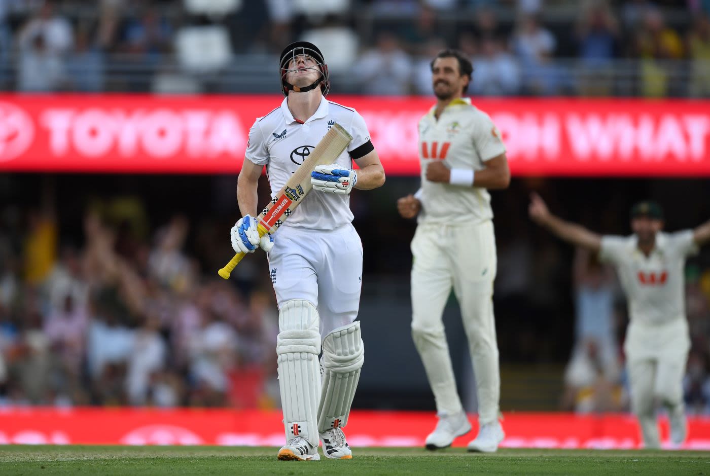 Harry Brook throws his head back after falling to Mitchell Starc ...