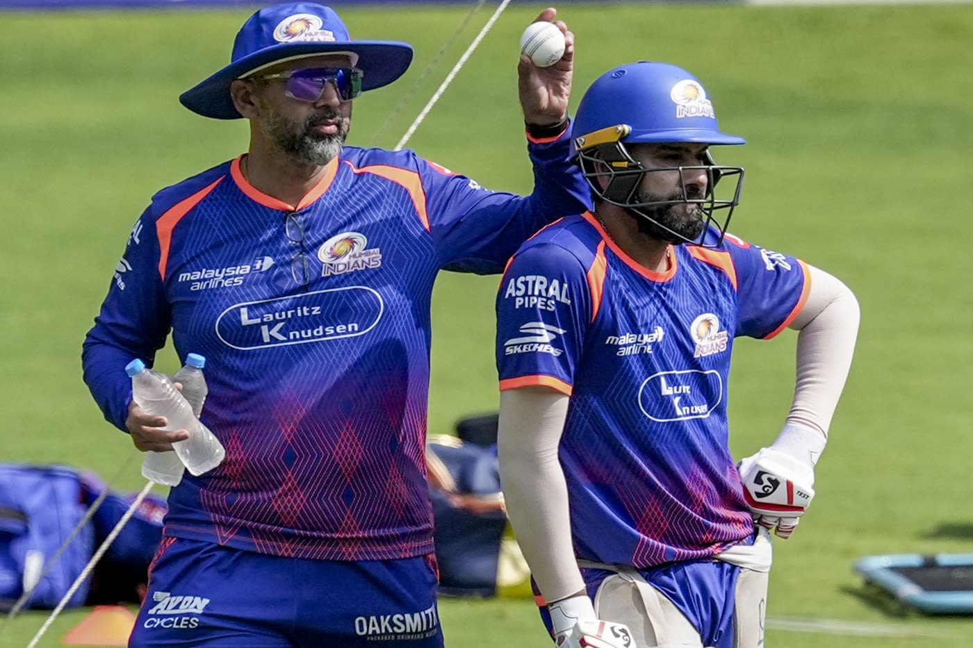 Rohit Sharma with MI bowling coach Paras Mhambrey at a training session ...