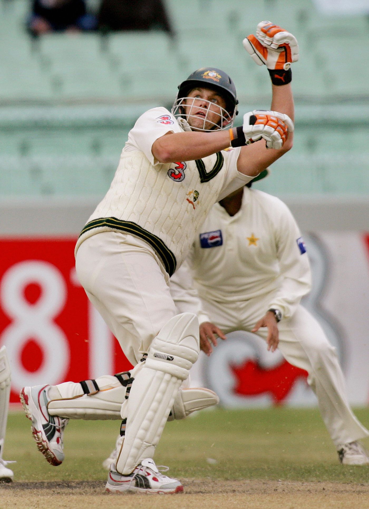 Adam Gilchrist watches his bat disappear along with the ball ...