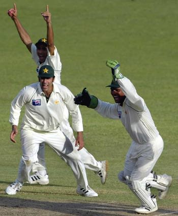 Yasir Hameed, Bazid Khan and Kamran Akmal celebrate the dismissal of ...