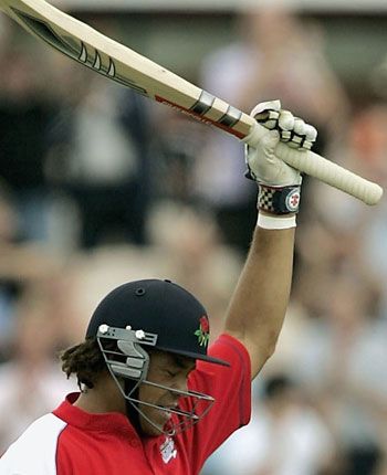Andrew Symonds raises his bat | ESPNcricinfo.com