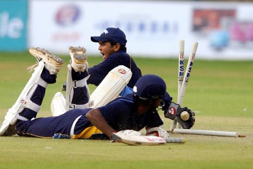 Parthiv Patel appeals for a run-out against Lakshmipathy Balaji in the ...