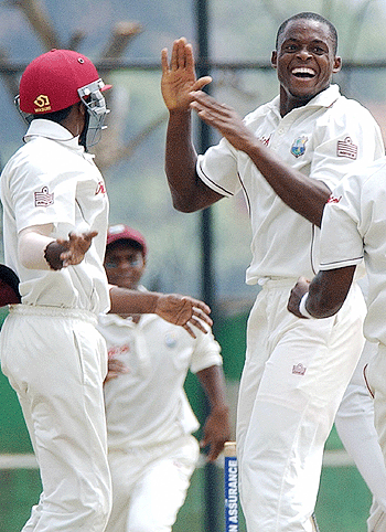 Daren Powell celebrates with his team-mates the dismissal of Sanath ...
