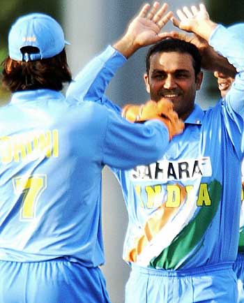 Virendar Sehwag celebrates one of his wickets | ESPNcricinfo.com