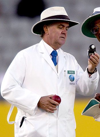 Doug Cowie checks out a light meter | ESPNcricinfo.com