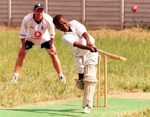 Nick Knight watches from slip as a young Zimbabwean displays his ...