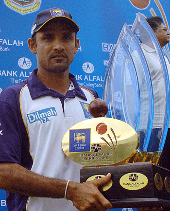 Marvan Atapattu poses with the trophy after blanking Bangladesh 3-0 ...
