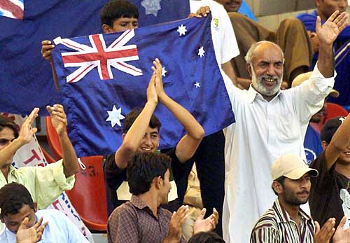 Dual allegiances: Pakistani supporters raise the Australian flag ...