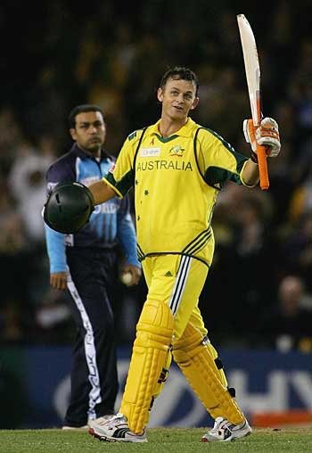 Adam Gilchrist raises his bat on reaching a thrilling century ...